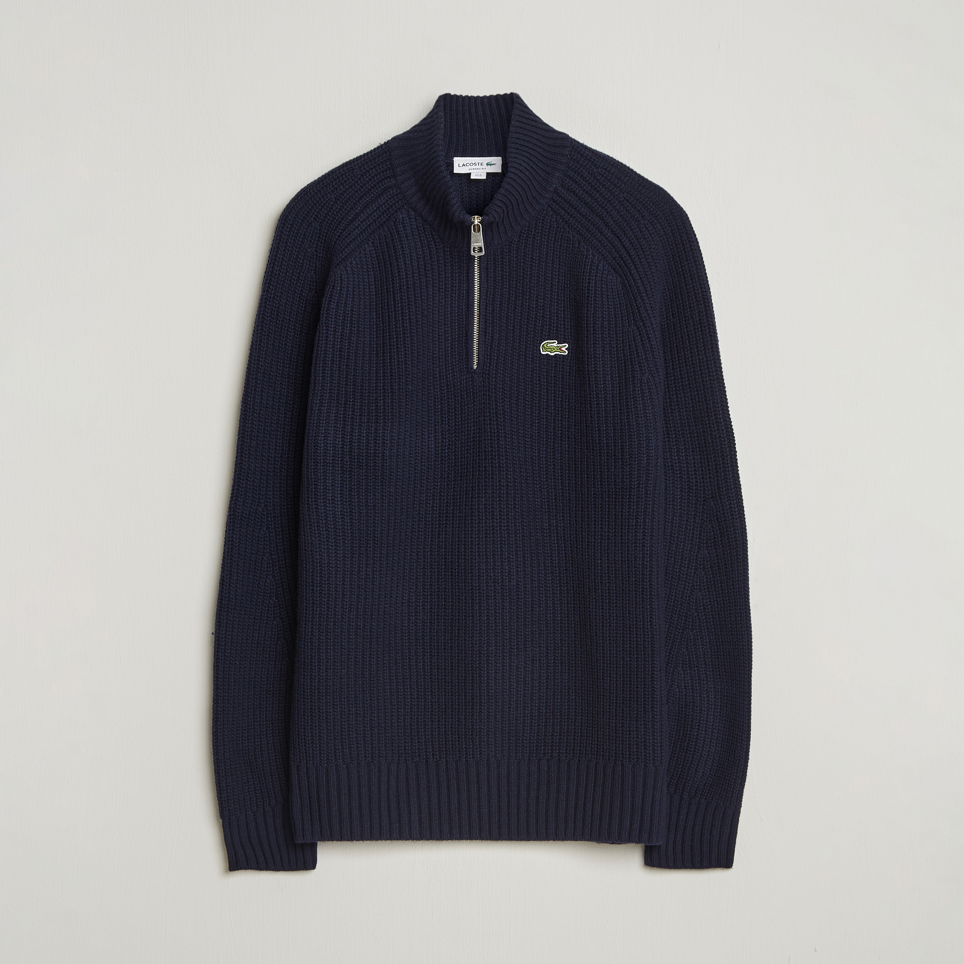 Lacoste Heavy Knitted Wool Half Zip Navy osoitteesta CareOfCarl.fi